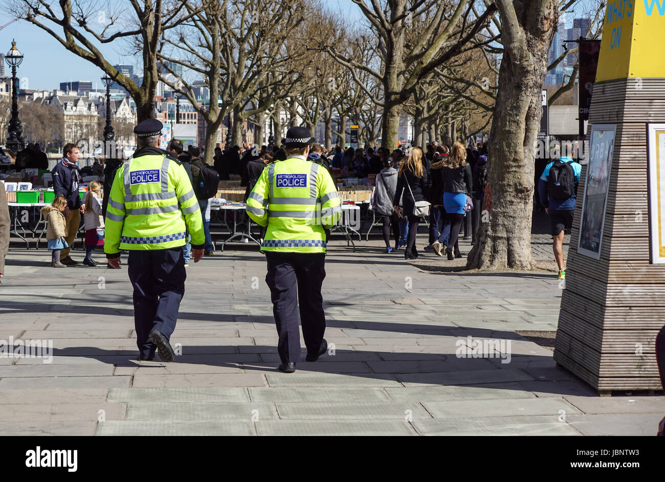 LONDON, UK - APRIL 22, 2017: London police walking on the sidewalk in ...