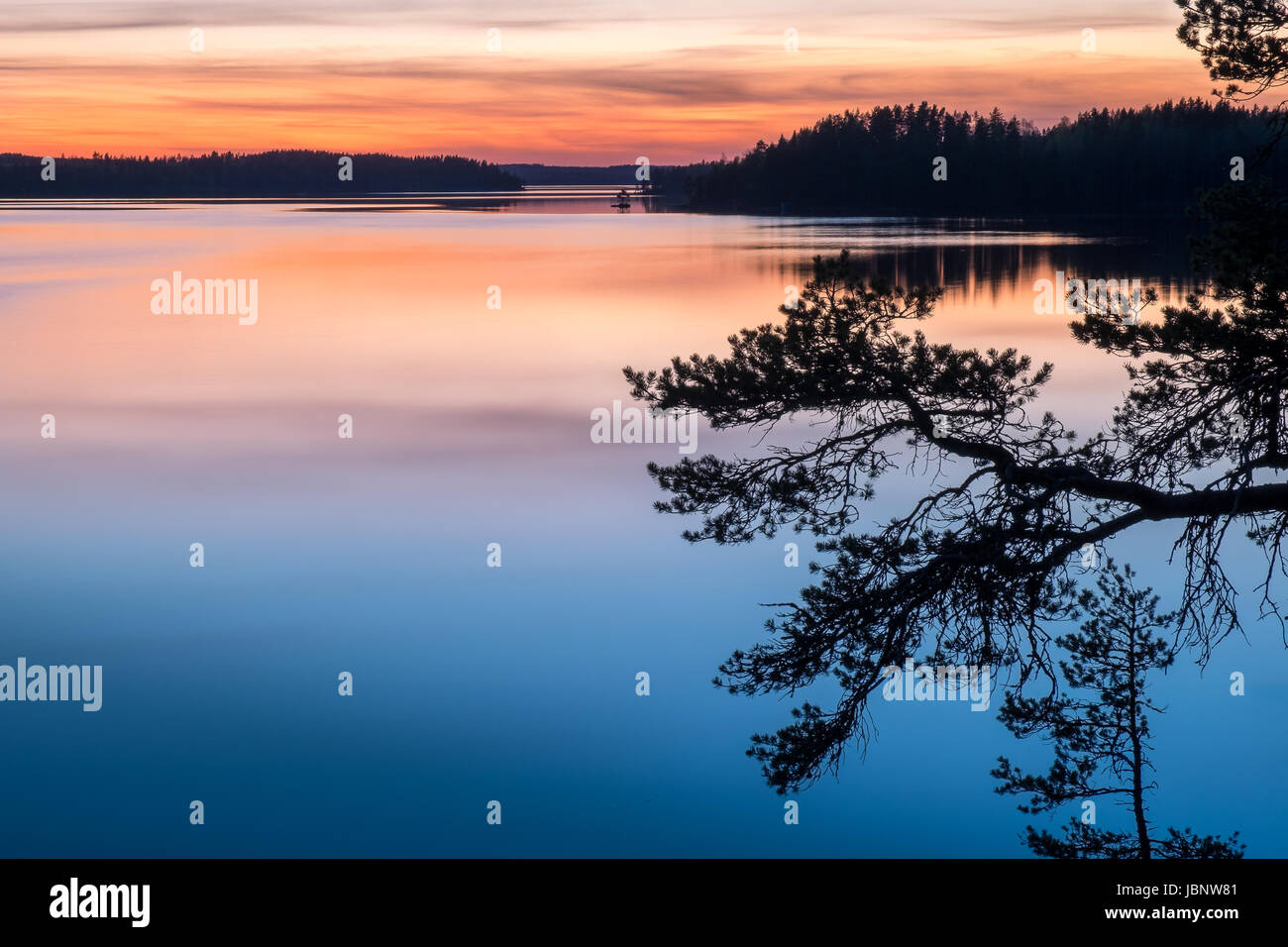 Scenic landscape over lake with sunset at spring evening in Finland ...