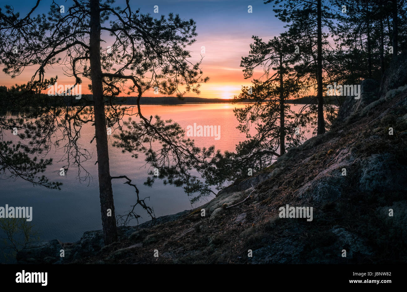 Scenic landscape over lake with sunset at spring evening in Finland ...
