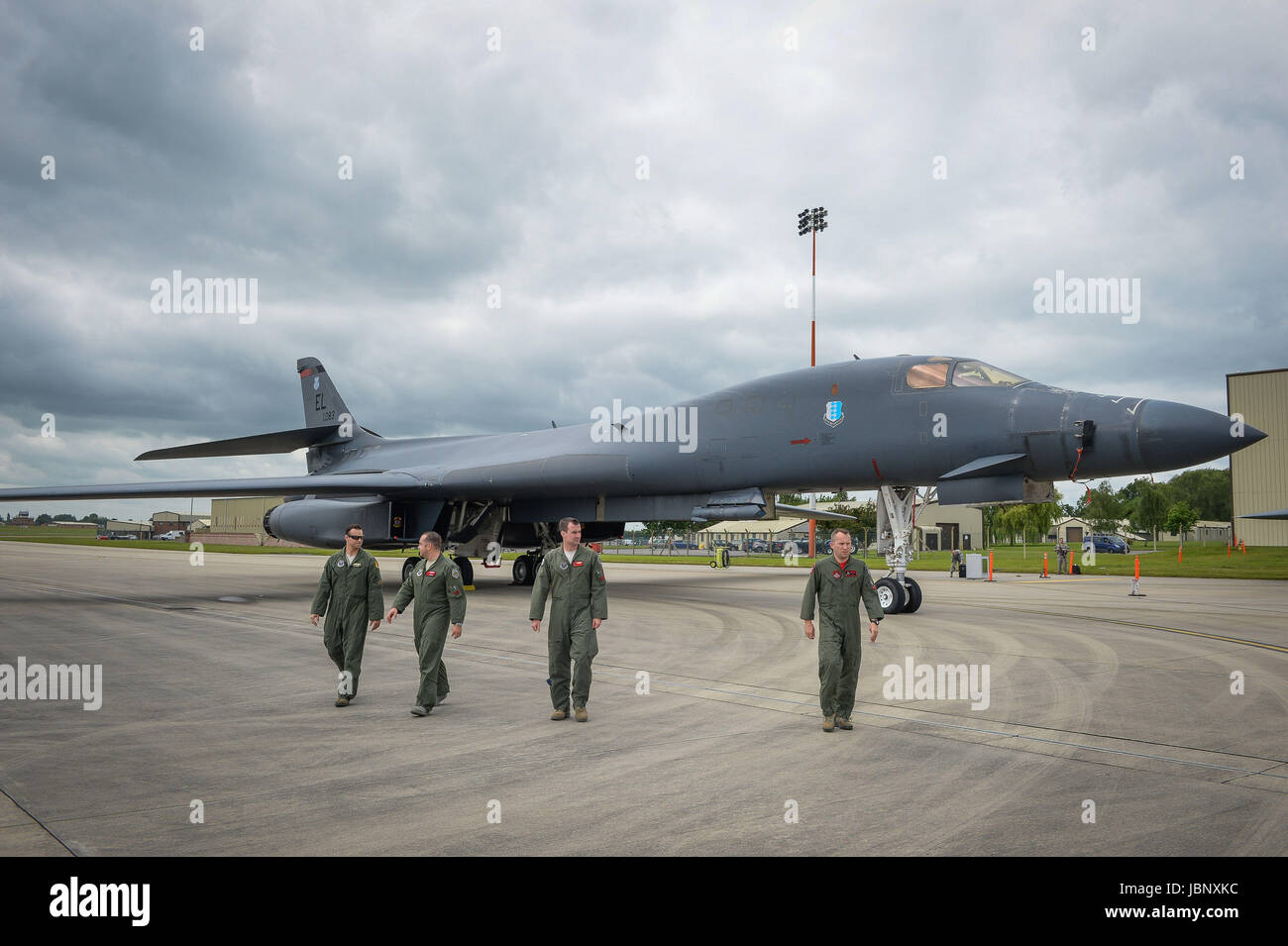 The flight crew of a B-1B Lancer walk away from the bomber as it sits ...
