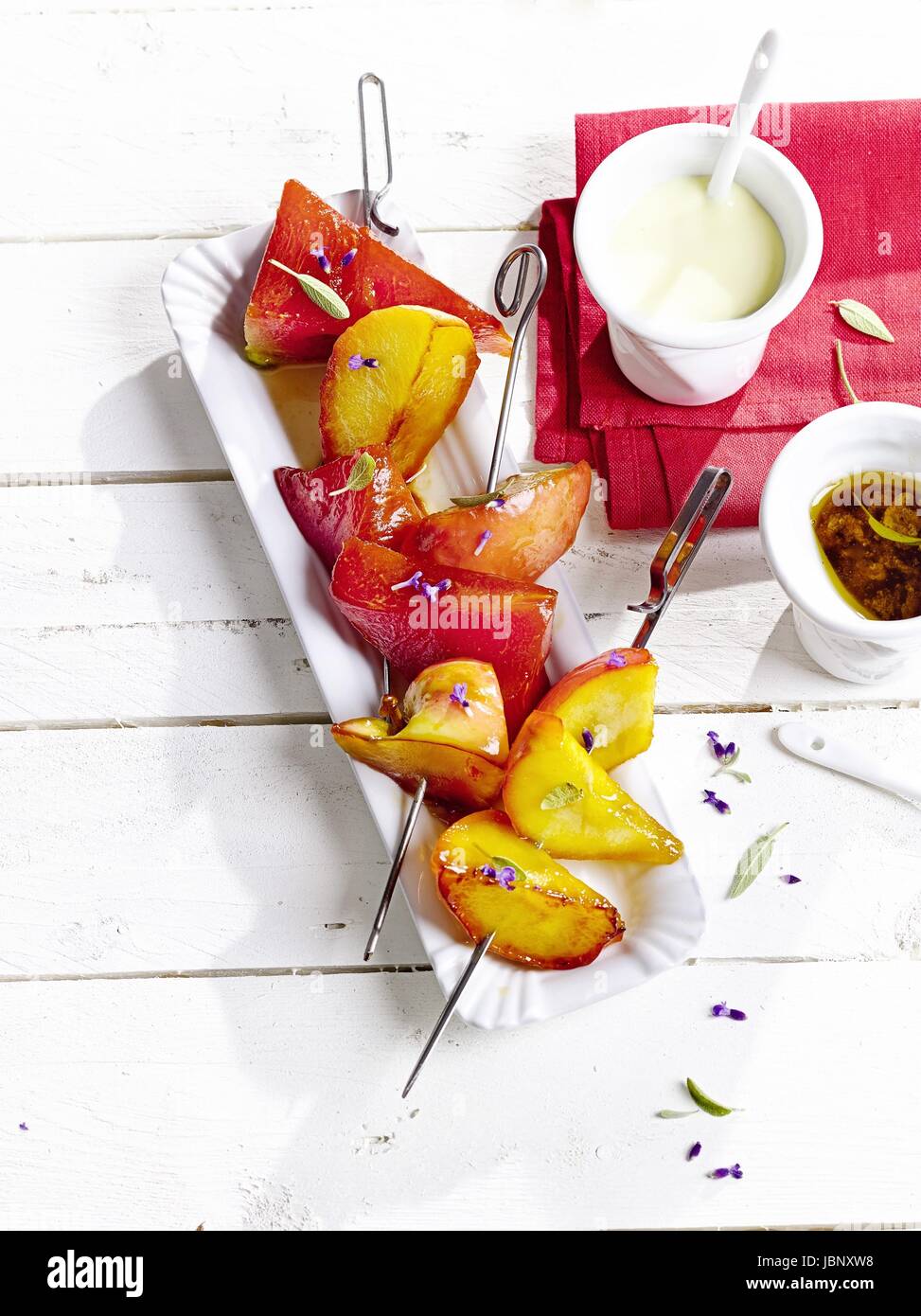 Roasted melon - apple - skewers Stock Photo - Alamy