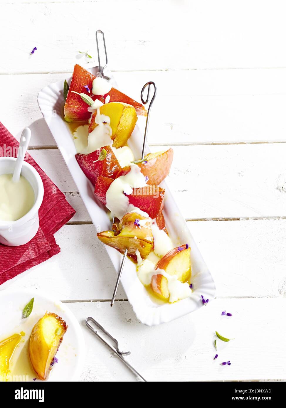 Roasted melon - apple - skewers Stock Photo - Alamy