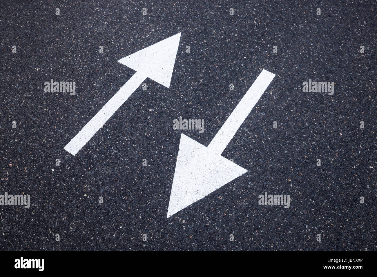 Direction sign on the asphalt road Stock Photo - Alamy