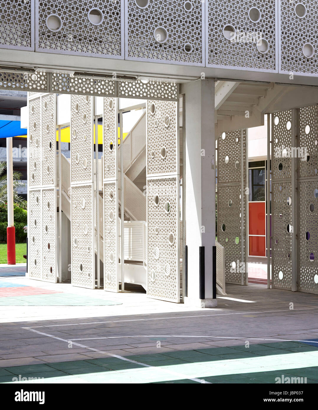 Courtyard stairs shaded by metal jali. Victory Heights Primary school ...