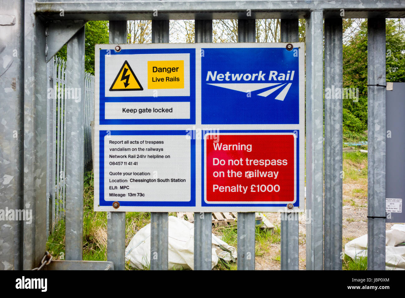 Network Rail warning sign on a fence. Danger Live Rails, do not ...