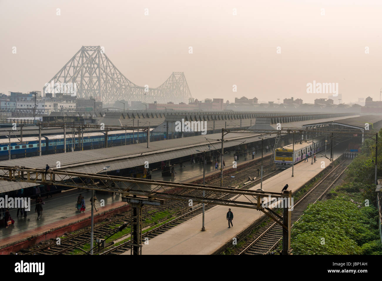 Howrah Railway Station with the the steel construction of Howrah Bridge ...