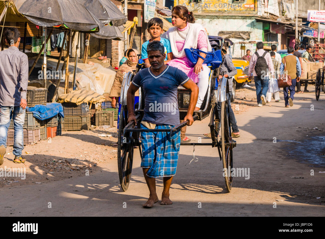 Man pulling a rickshaw hi-res stock photography and images - Alamy