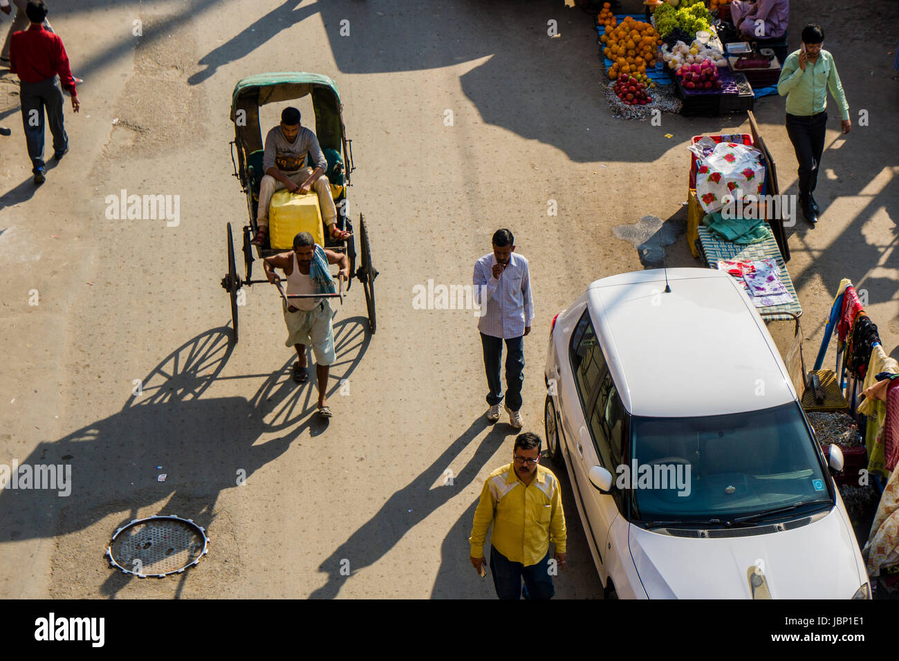 Aerial view on a man pulling a rickshaw on a road in the suburb New ...