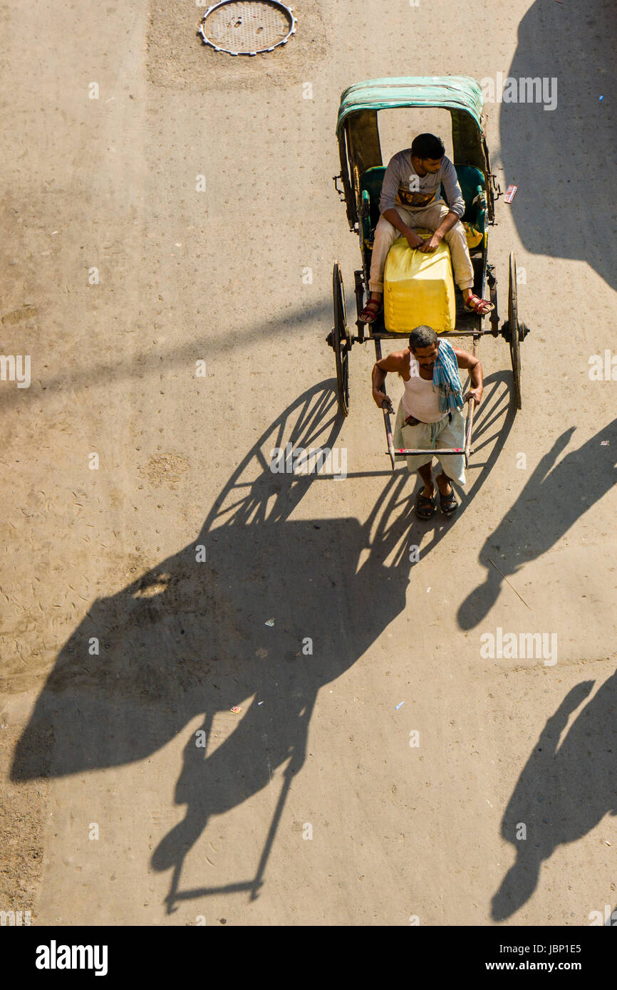 Aerial view on a man pulling a rickshaw on a road in the suburb New ...
