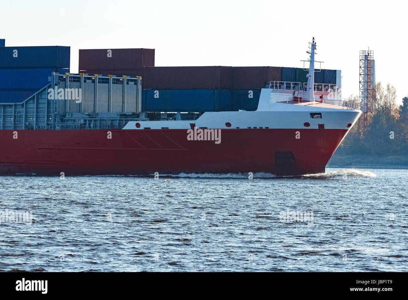 Red container ship sailing to the Baltic sea Stock Photo - Alamy