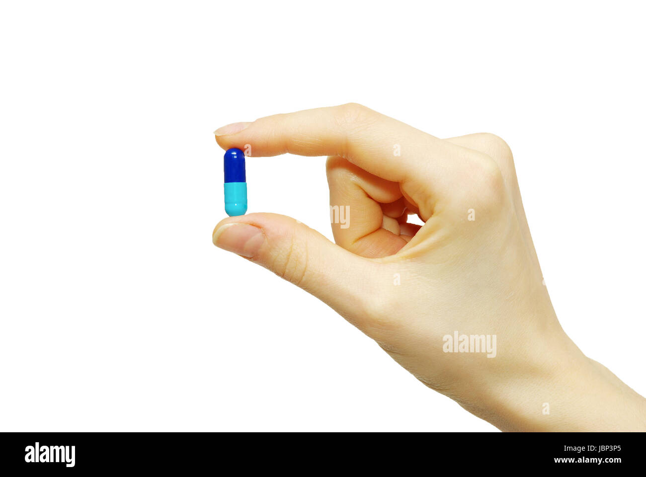 finger holds pill isolated on white Stock Photo - Alamy
