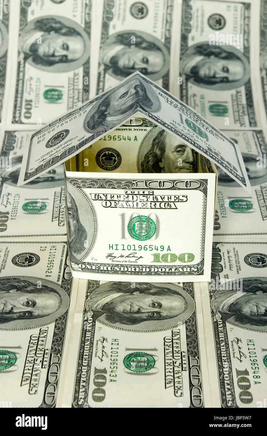 Money house on dollars background Stock Photo - Alamy