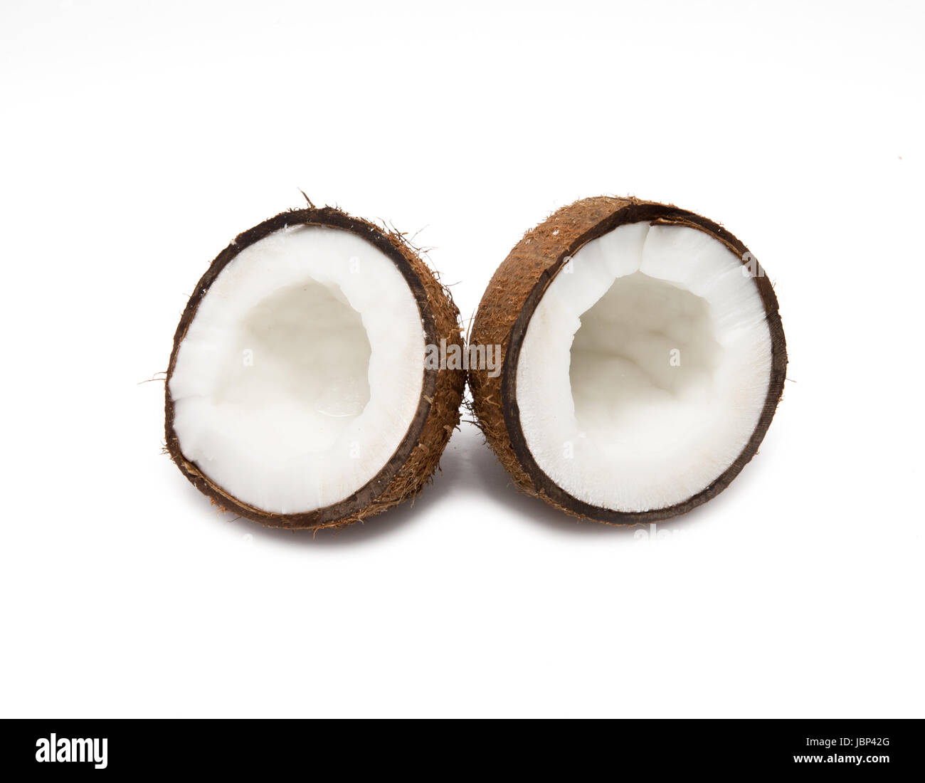 coconut cut in half on white background Stock Photo - Alamy