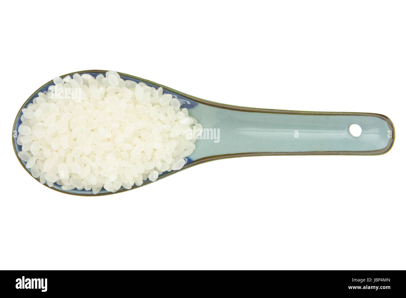 close up of rice with china scoop isolated on white background Stock ...