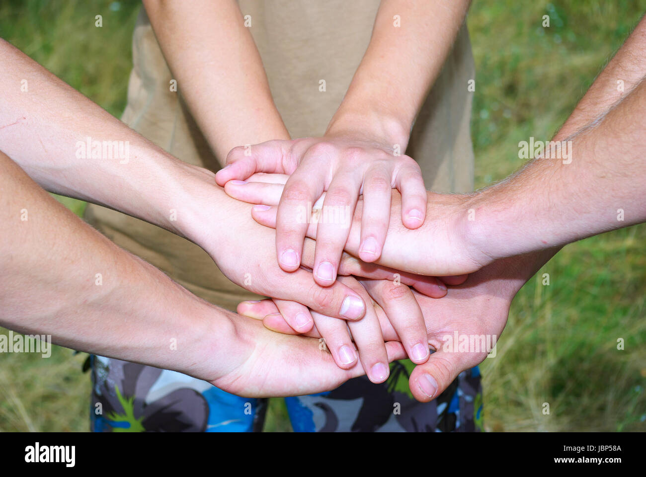 Hands many friends reaching hi-res stock photography and images - Alamy