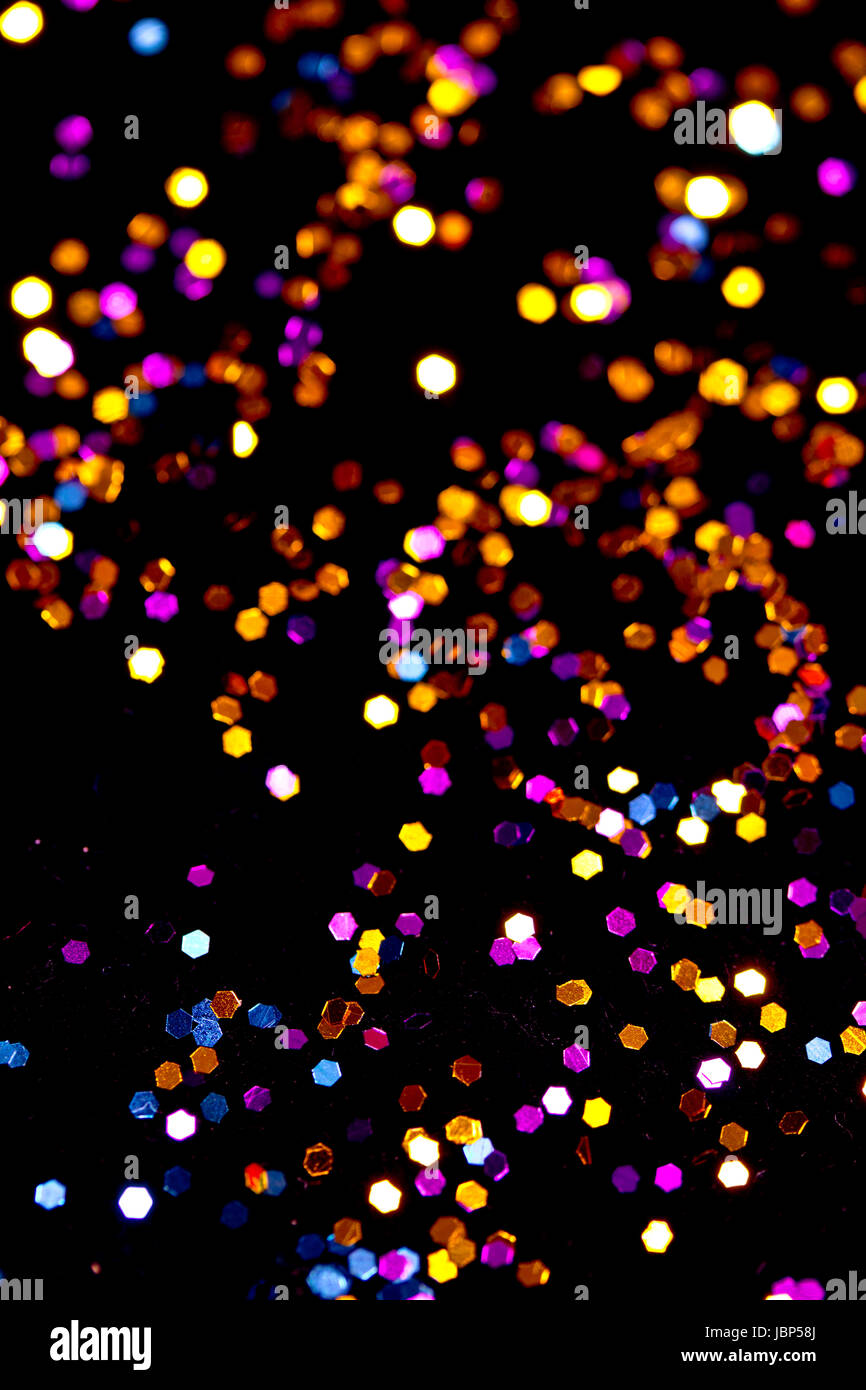 Glitter Bokeh Confetti On Black Background Stock Photo - Alamy