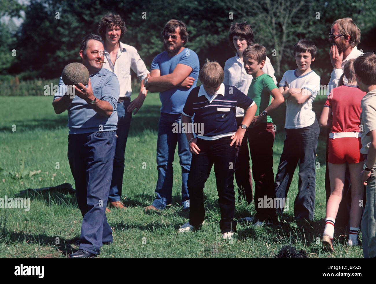 The throwing of a heavy metal ball game at Village St Clair Fete ...