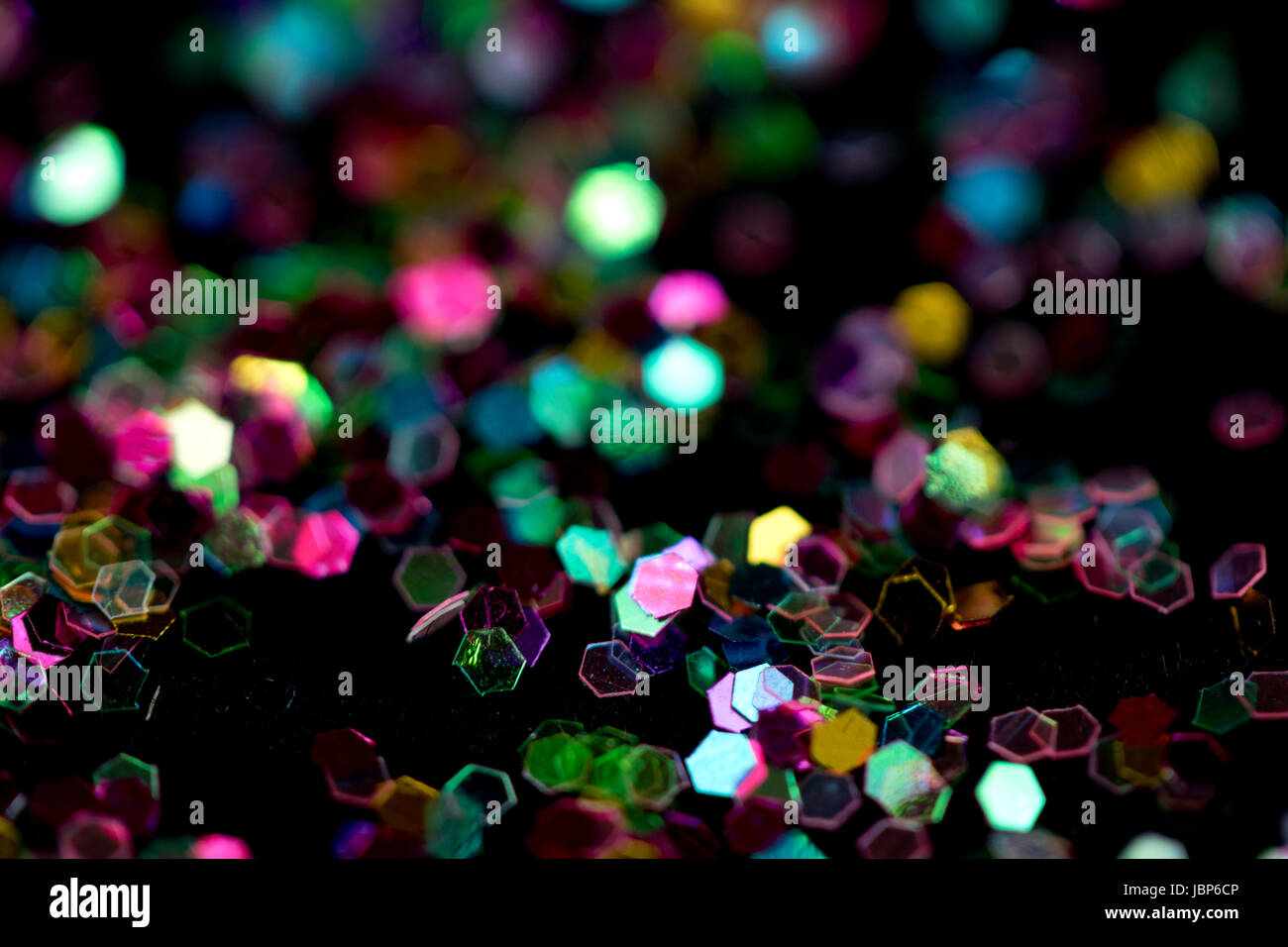 Glitter Bokeh Confetti On Black Background Stock Photo - Alamy
