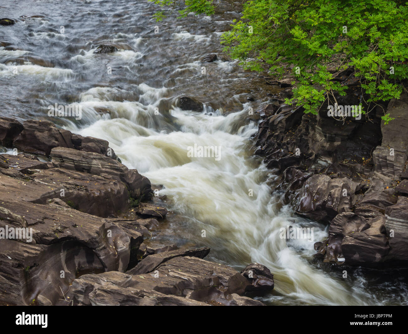 Fast flowing river in the landscape of the Elan Valley, Wales, at ...