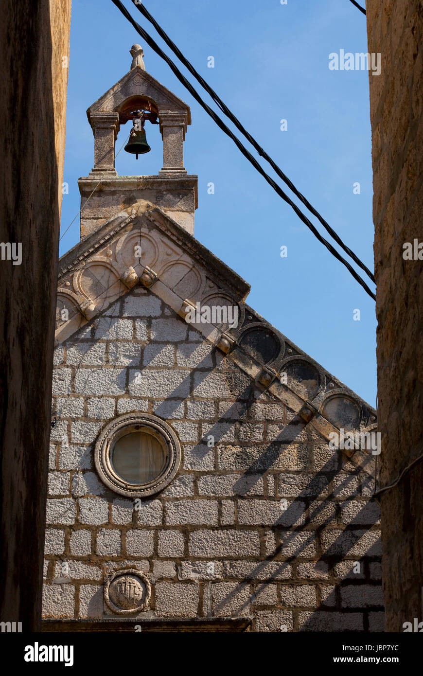 Church gable with bell, Lopud, Croatia Stock Photo - Alamy