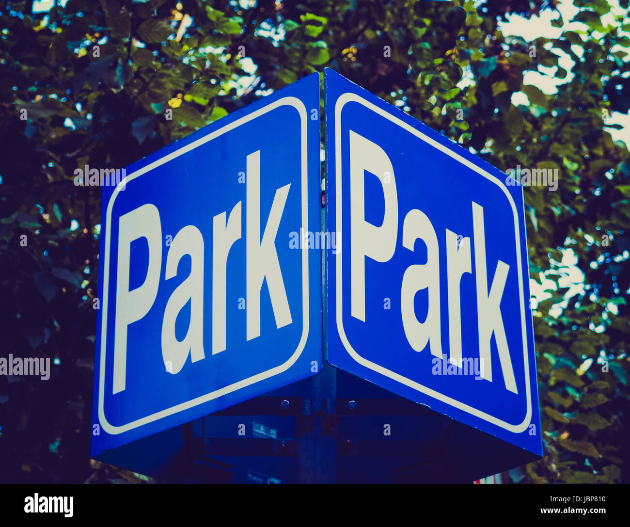 Vintage retro looking A road sign for a parking area Stock Photo - Alamy