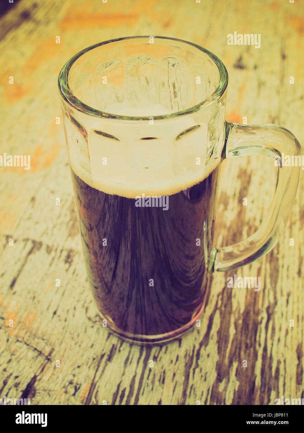 Vintage retro looking A glass of German dark beer Stock Photo - Alamy