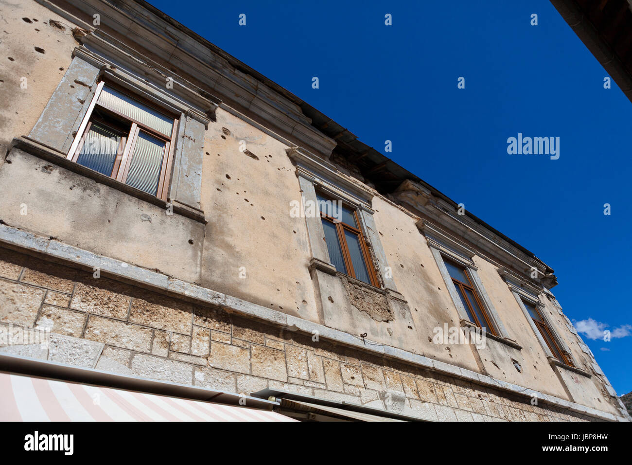 Bullet holes in side of building in Mostar Stock Photo - Alamy