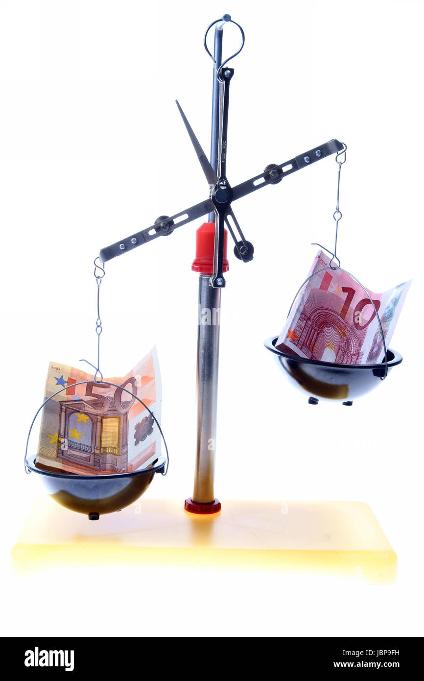 scale pan with money Stock Photo - Alamy