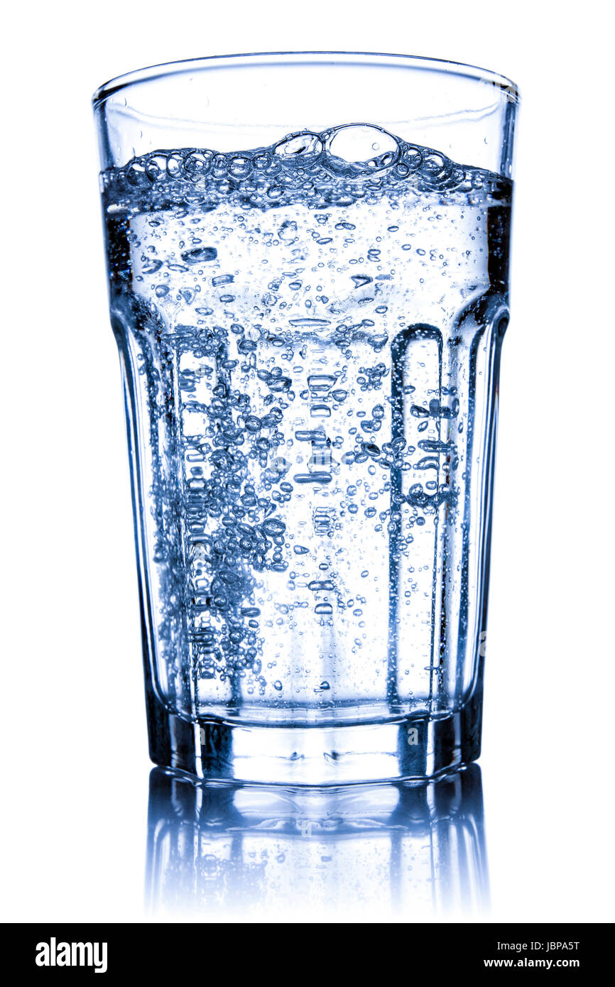 Glass filled with sparkling water. Isolated on white background Stock ...