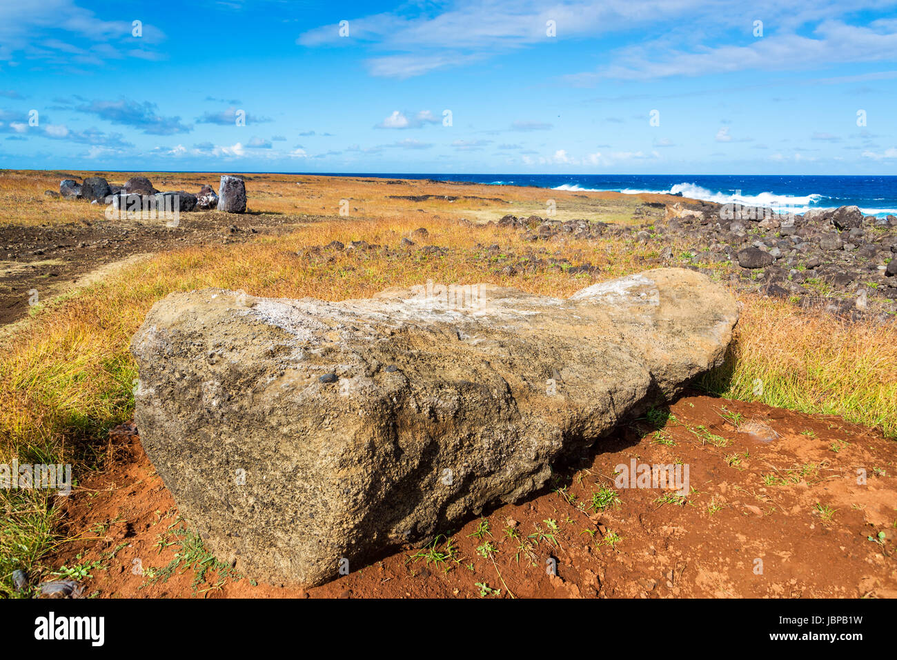 Damaged Moai on Easter Island lying facedown near the shore line Stock ...