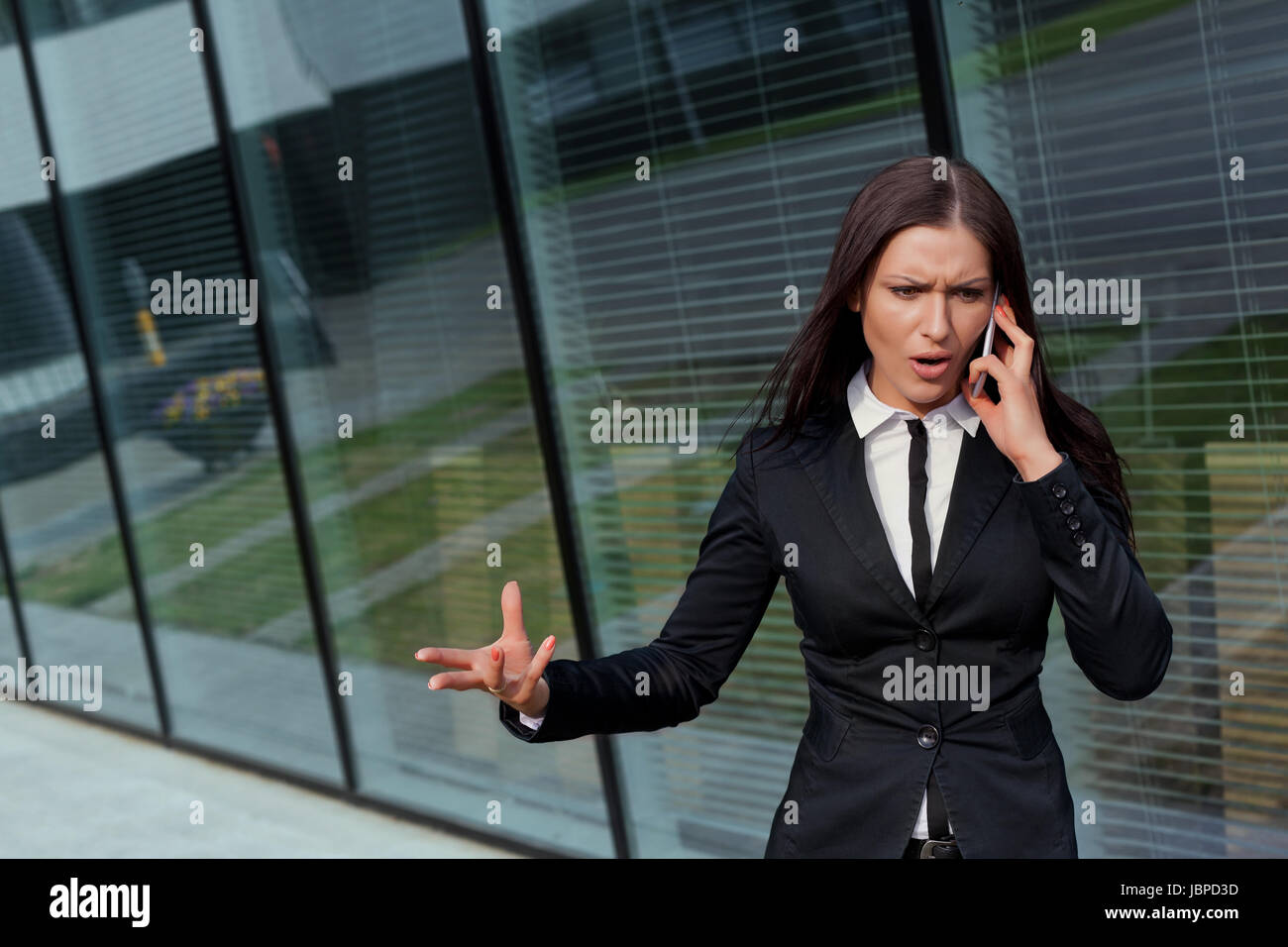 Beautiful business woman bossy on the phone Stock Photo - Alamy