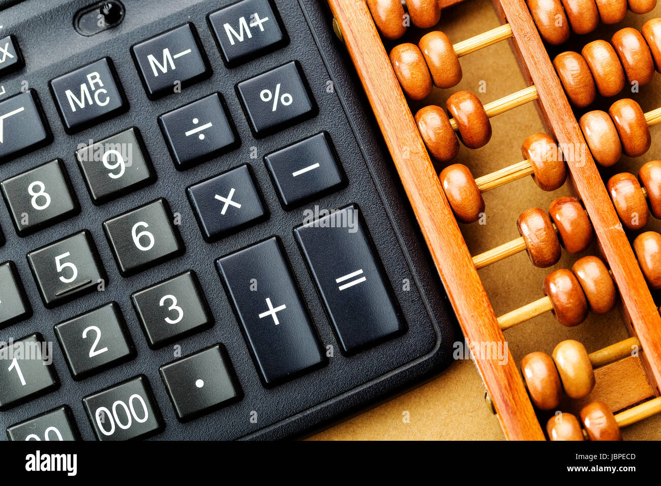 Modern calculator and abacus Stock Photo - Alamy