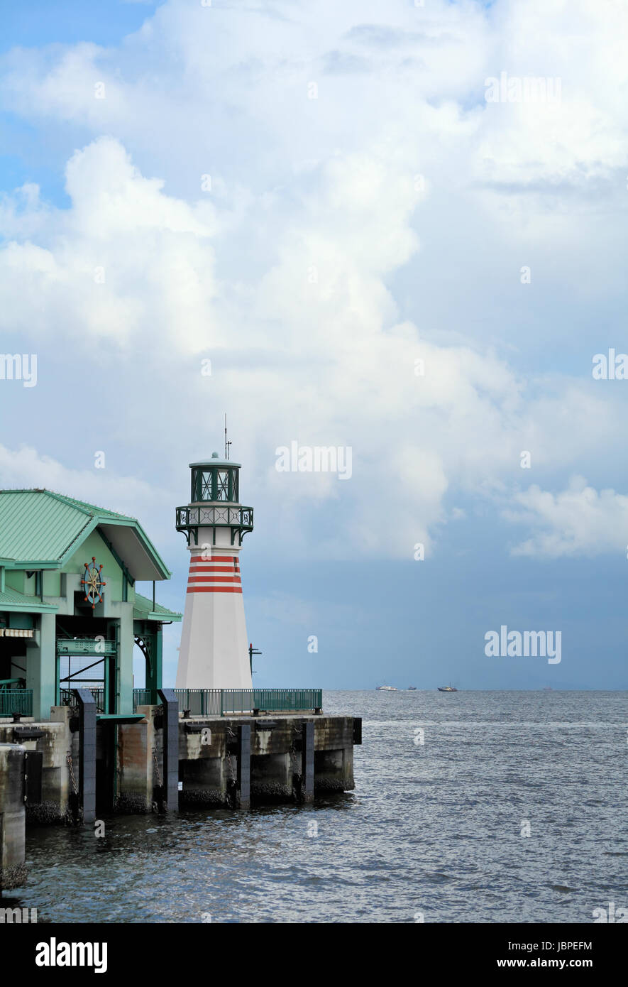 Lighthouse at pier Stock Photo - Alamy