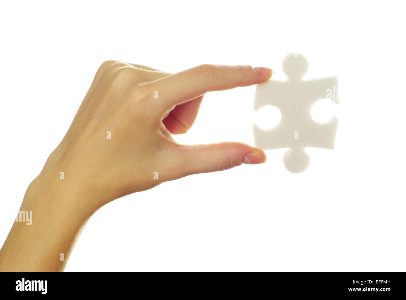 puzzle in hand isolated on white background Stock Photo - Alamy