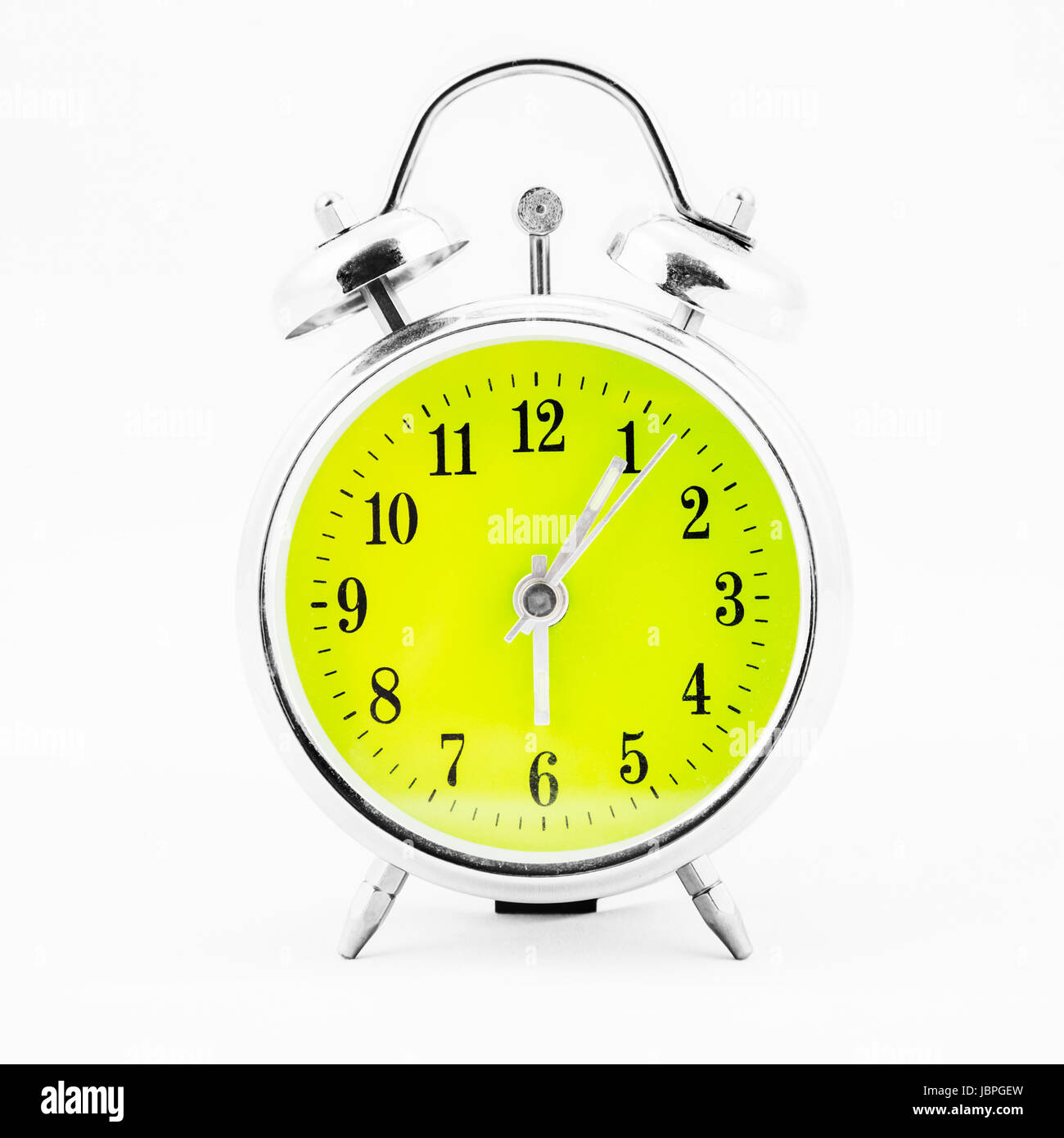 Alarm clock on white background. Showing time five minutes past six ...