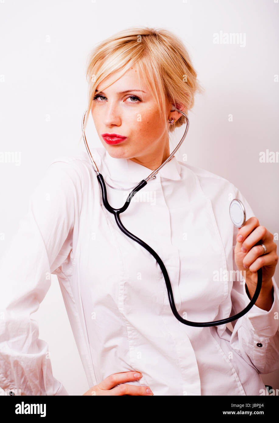 young pretty woman doctor with stethoscope on white background i Stock ...