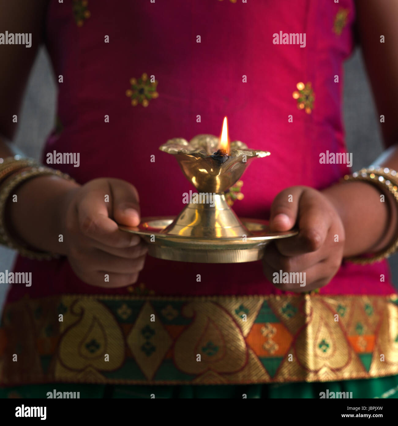 Hands holding oil lamp hi-res stock photography and images - Alamy