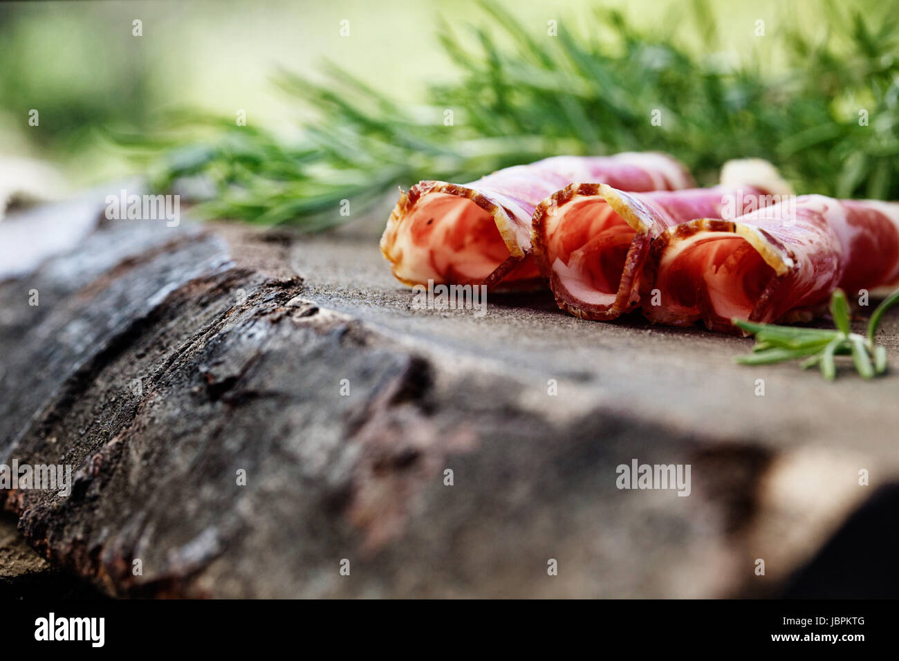 Coppa pork collar ham. Cold cuts on wood. Rustic ham prosciutto Stock ...