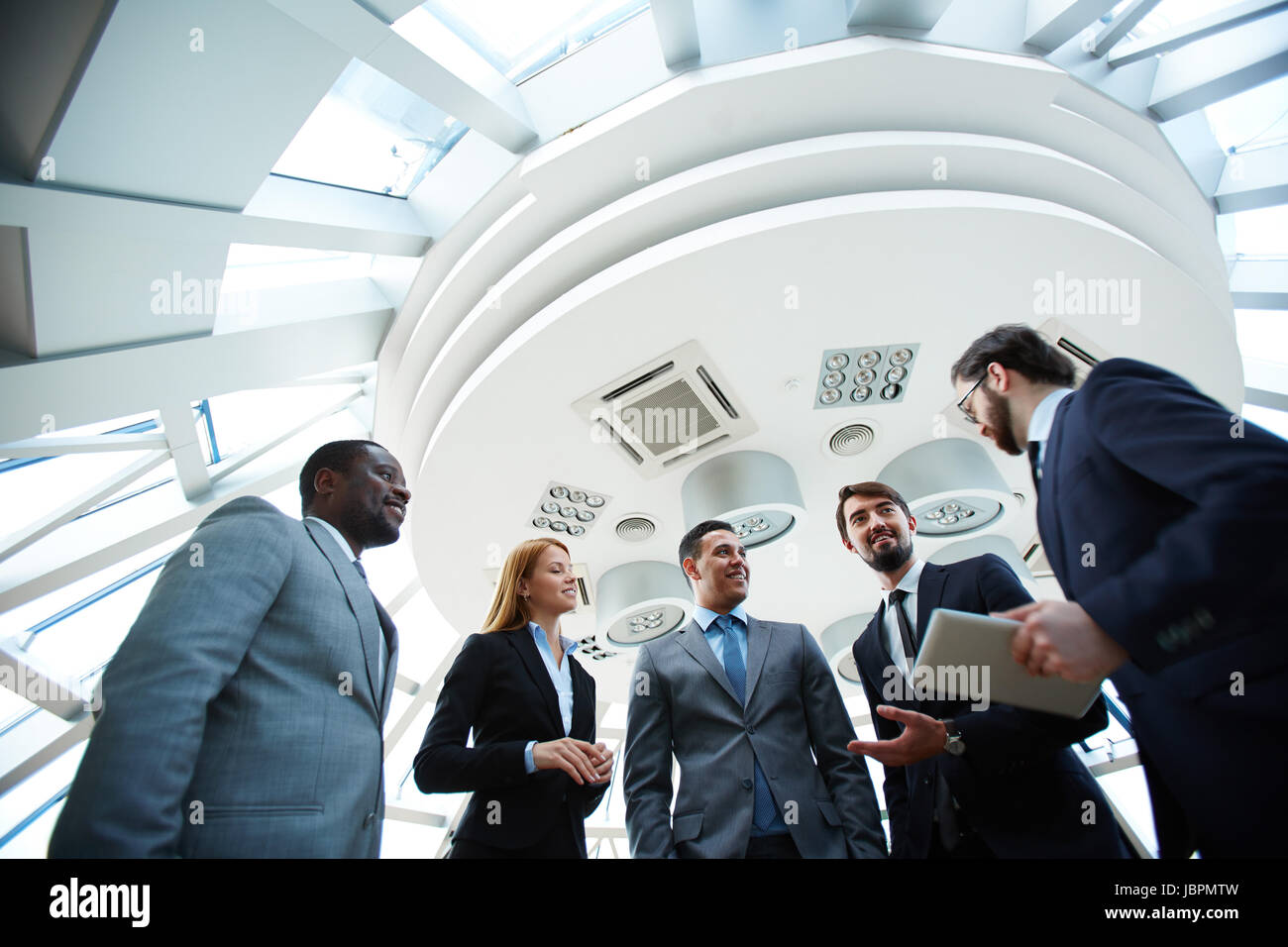 Group of business people discussing ideas at meeting Stock Photo - Alamy