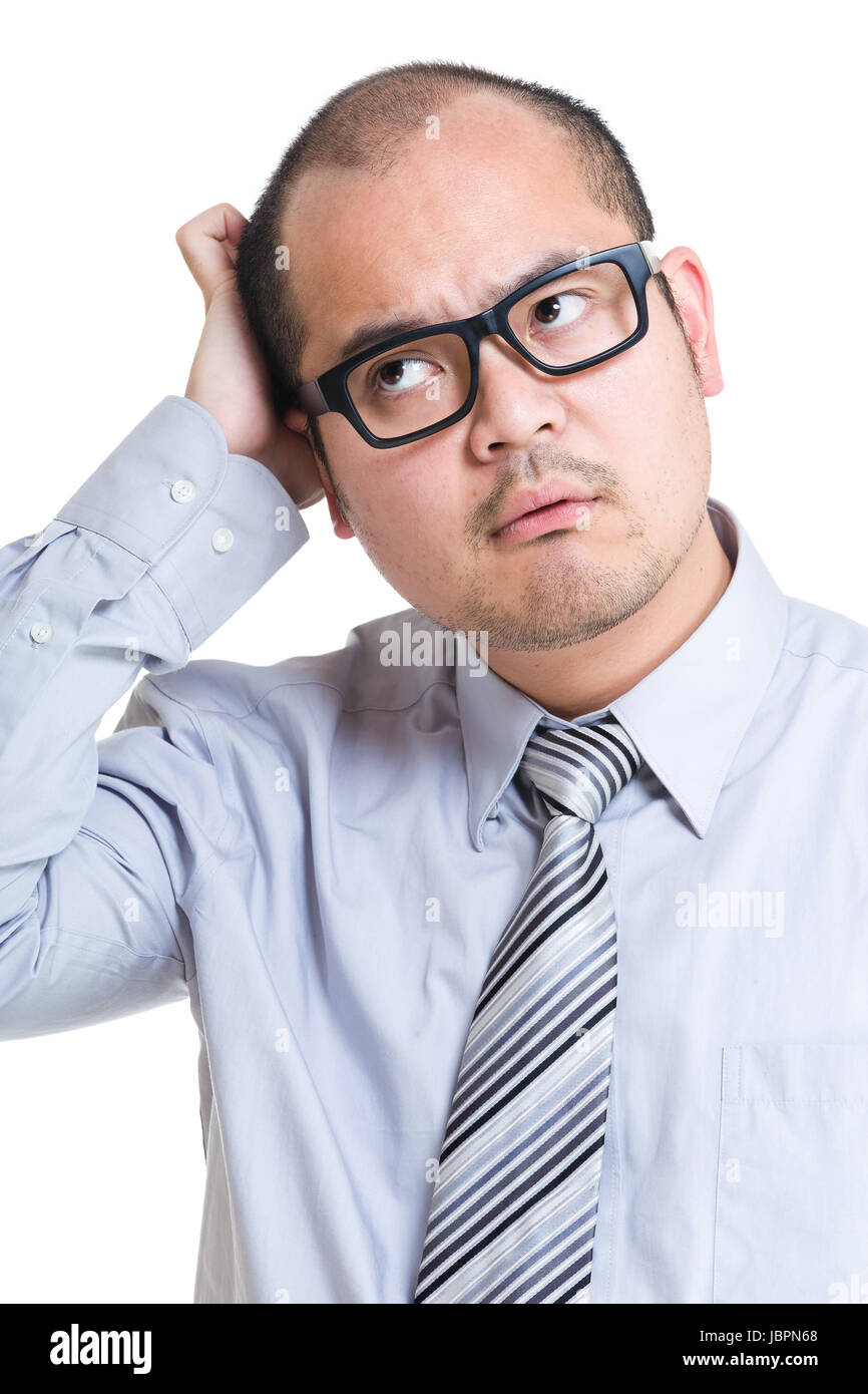 Businessman scratching head Stock Photo - Alamy