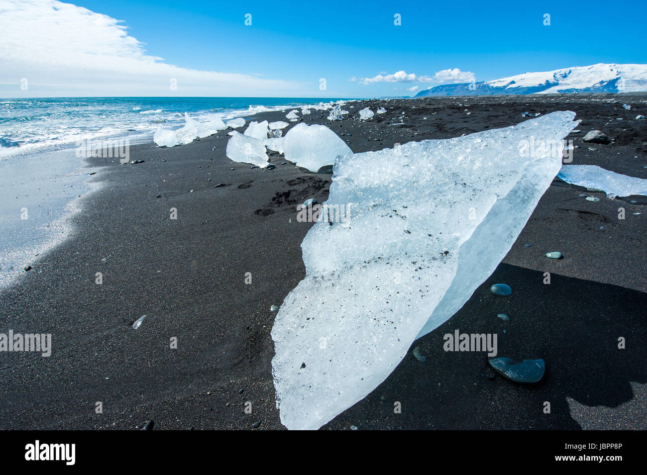 Beautiful beach in the South of Iceland with a black lava sand is full ...