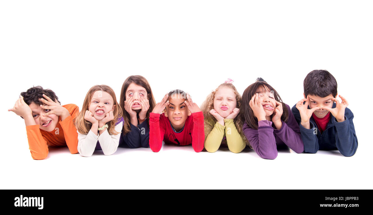 Group of children making funny faces isolated in white Stock Photo - Alamy