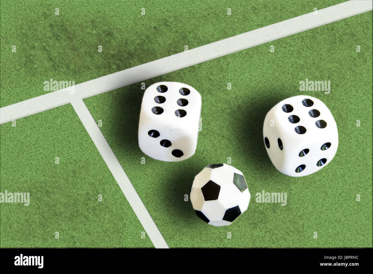 Gambling with dice and football win money Stock Photo - Alamy