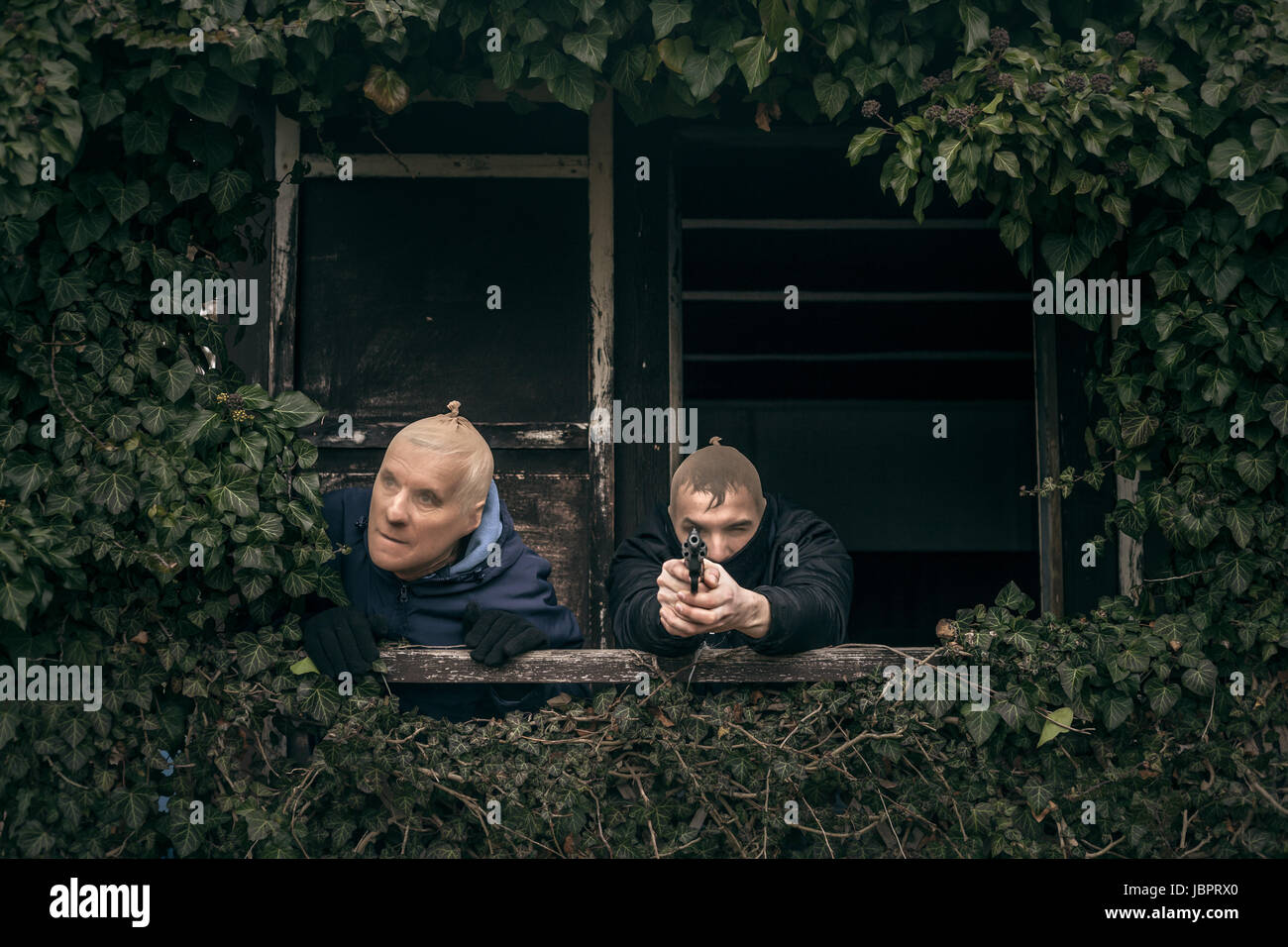 Two armed men hiding on hi-res stock photography and images - Alamy