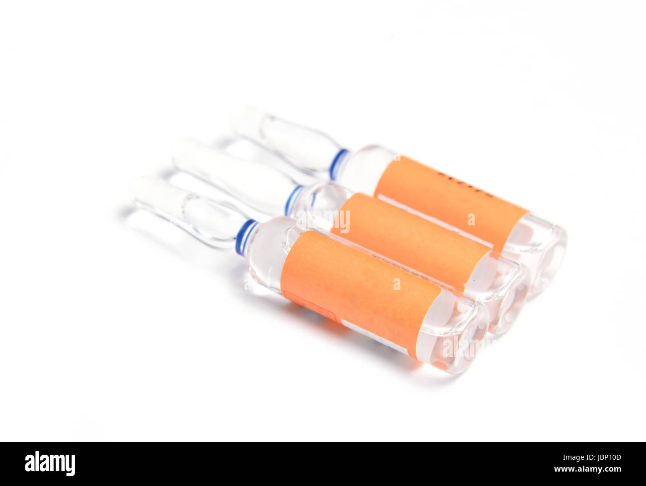 ampule isolated on white table Stock Photo - Alamy