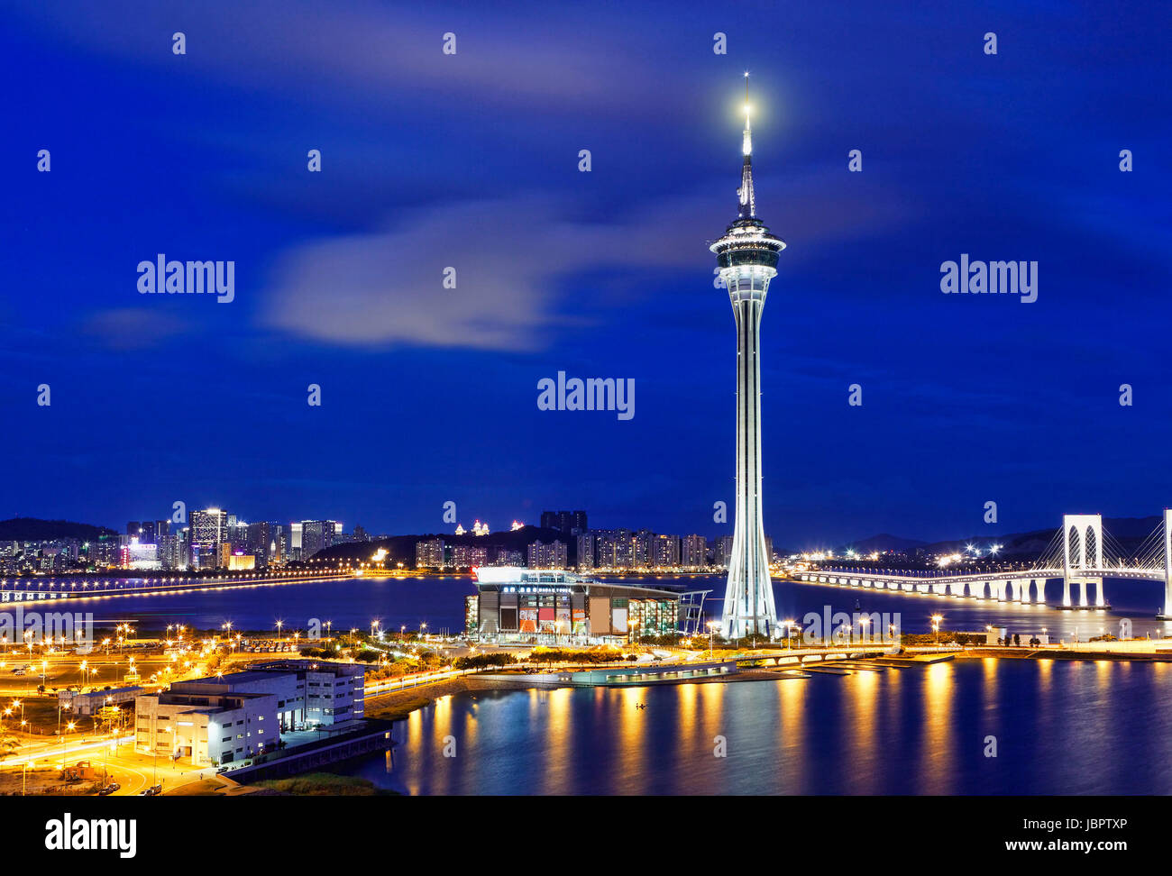 Urban landscape of Macau with famous traveling tower under blue sky ...