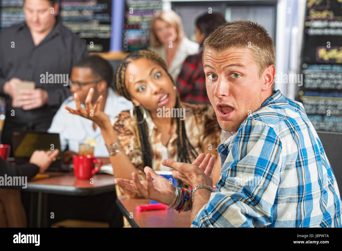 Embarrassed group in cafe hi-res stock photography and images - Alamy