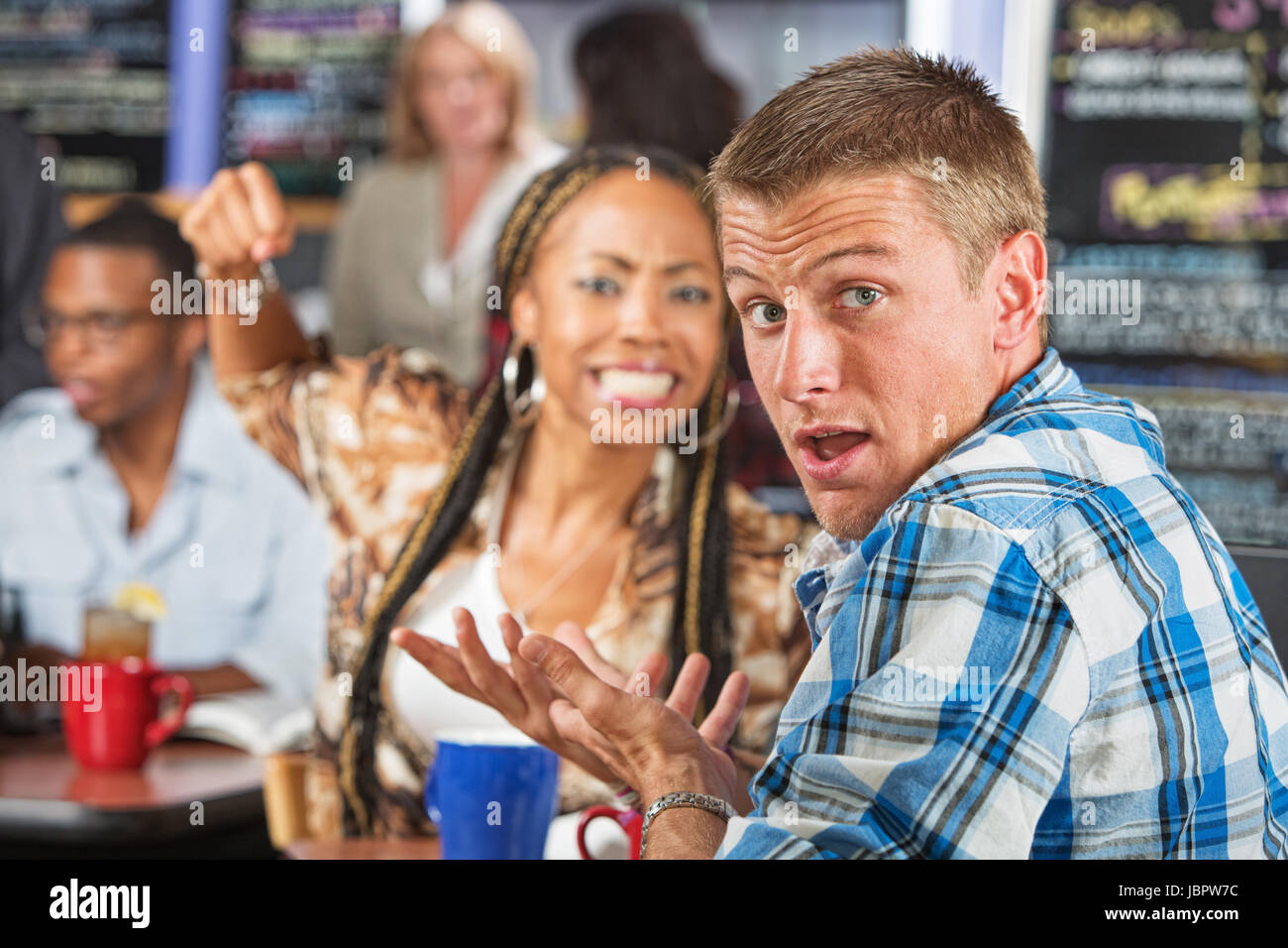 Embarrassed group in cafe hi-res stock photography and images - Alamy