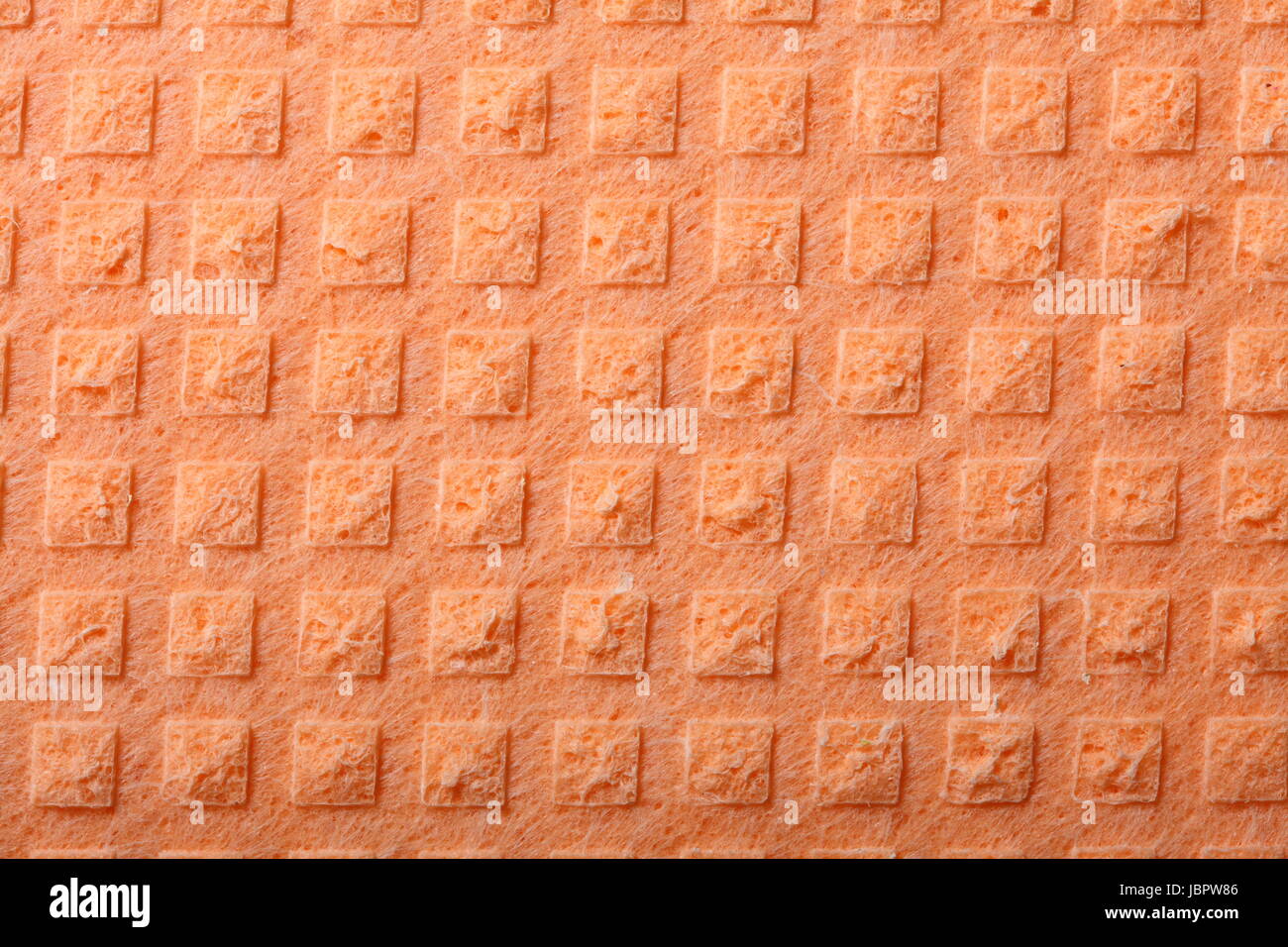Orange kitchen sponge rubber foam as background texture Stock Photo - Alamy