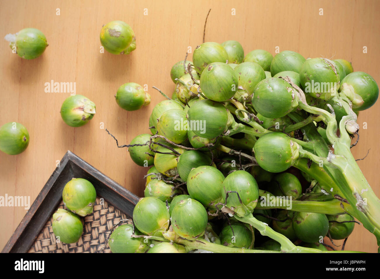 betel nut and tray on a wooden Stock Photo - Alamy